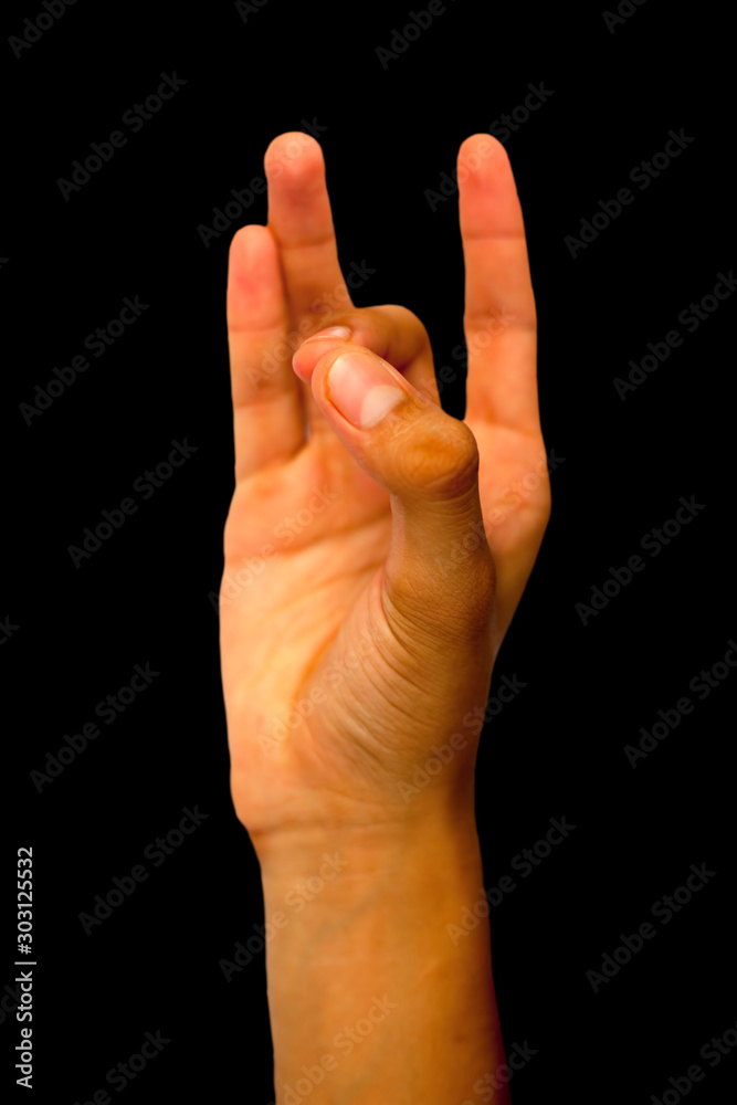 Isolated hand of a male teenage boy doing Shuni or Shoonya Yoga Mudra ...