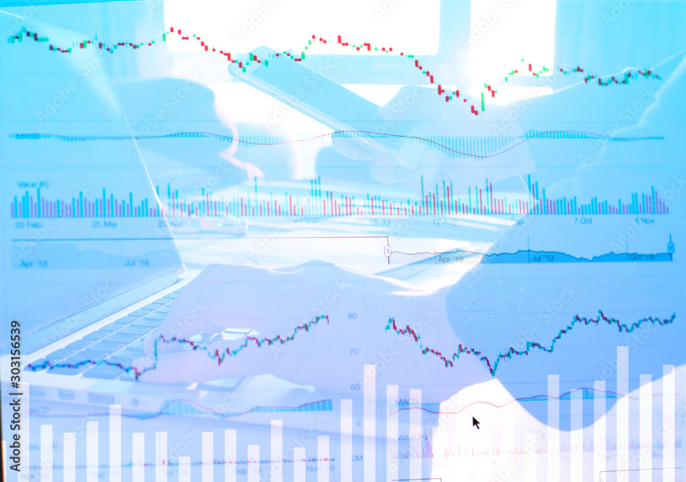 double exposure stock graph chart candle stick on monitor and close up ...