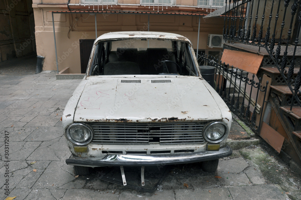 Soviet car VAZ-2101 Lada. Grow auto trash in the courtyard of an ...