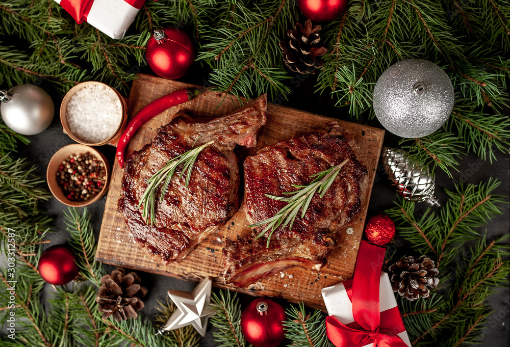 Christmas dinner for two, grilled beef steak ribeye, herbs and spices ...