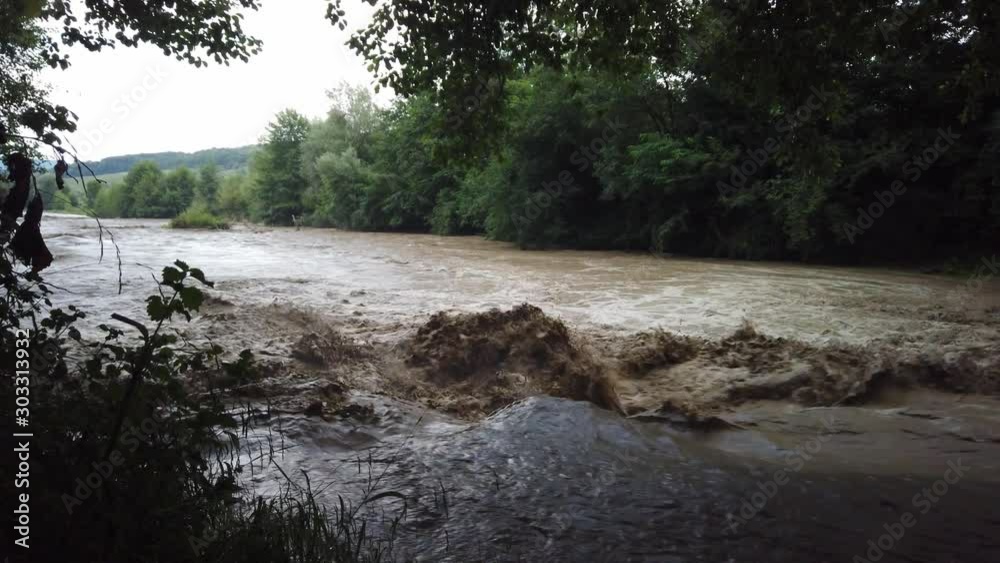 Small river formed in the forest after the rain, making its way through ...