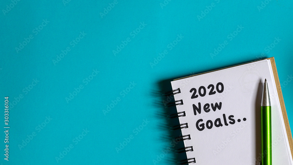 2020 new year goal, plan, action text on note pad. Top view or flat lay ...