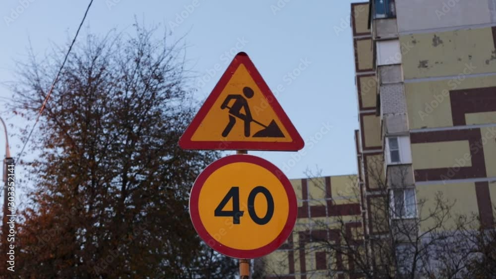 Vidéo Stock 40 km / h speed limit sign and road repair work. Signs on a ...