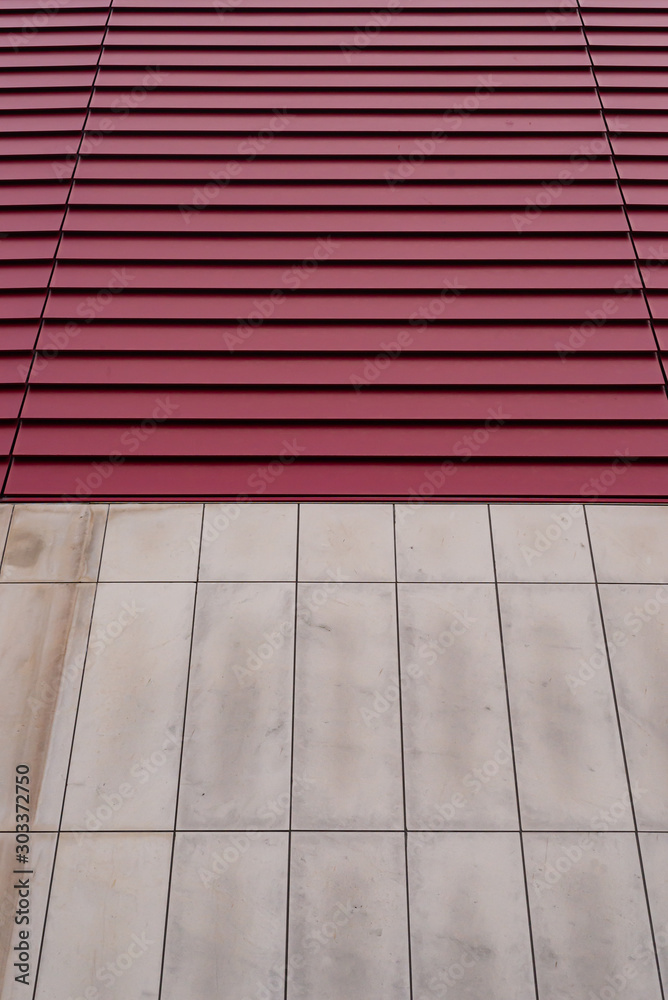 .Modern architectural details. The facade is red and gray, metal and ...