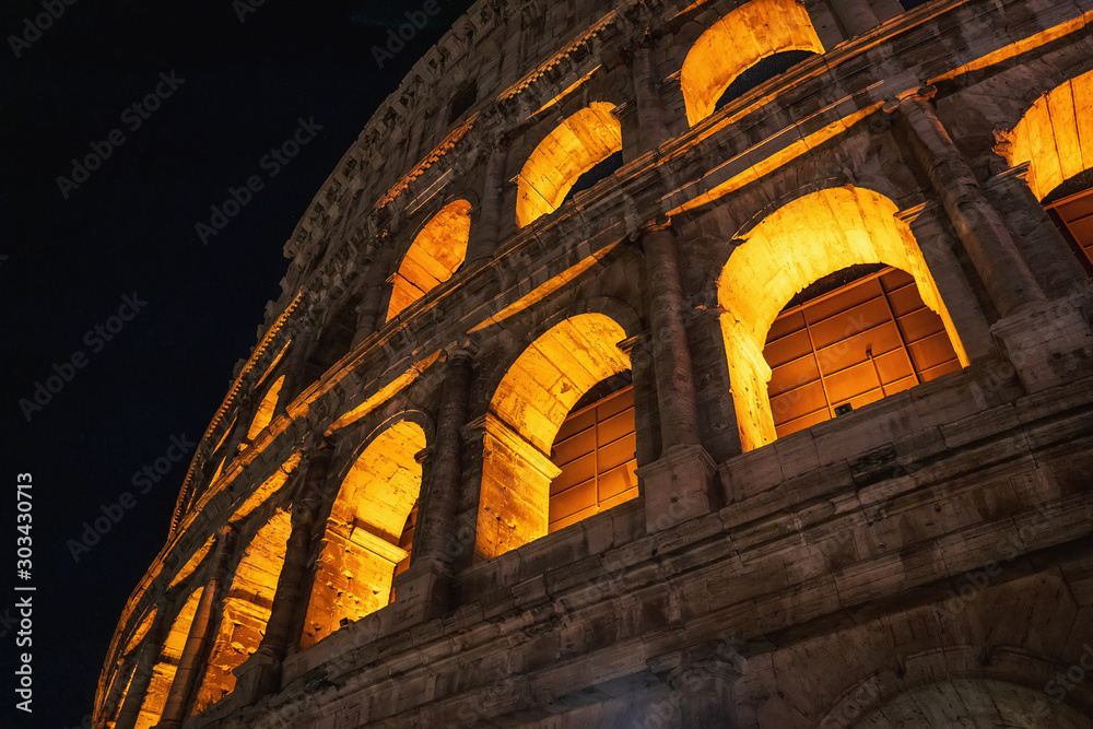 Colosseum, or Coliseum wall with night illumination. Huge Roman ...