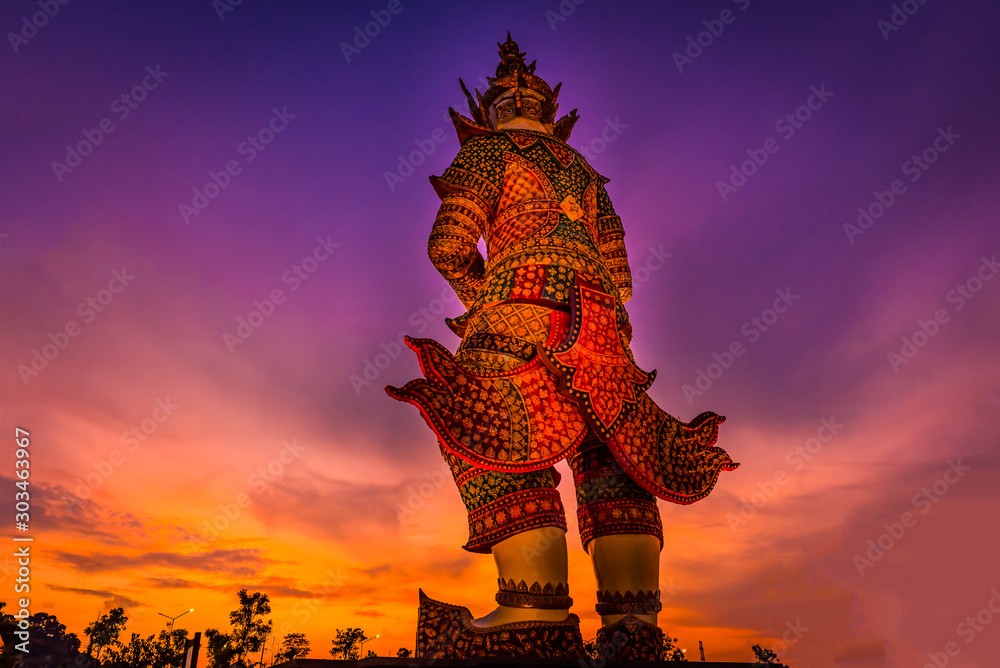 A beautiful big statue giant in ancient at in front of new landmark of ...