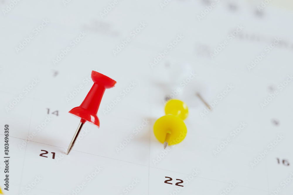 mark the event day with a pin red. tack in calendar concept for busy ...