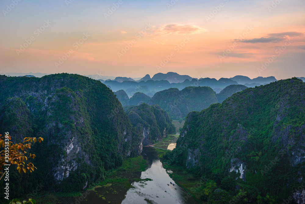 Aerial view at sunset of Ninh Binh region, Tam Coc valley tourist ...