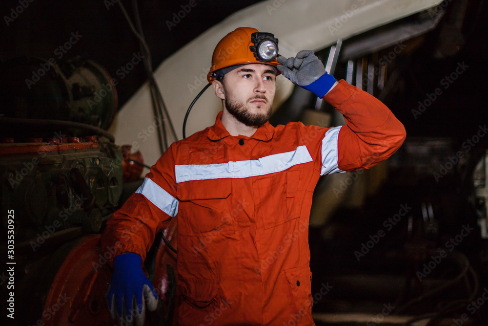 profession of a miner. A young miner in a coal mine in the generals is ...