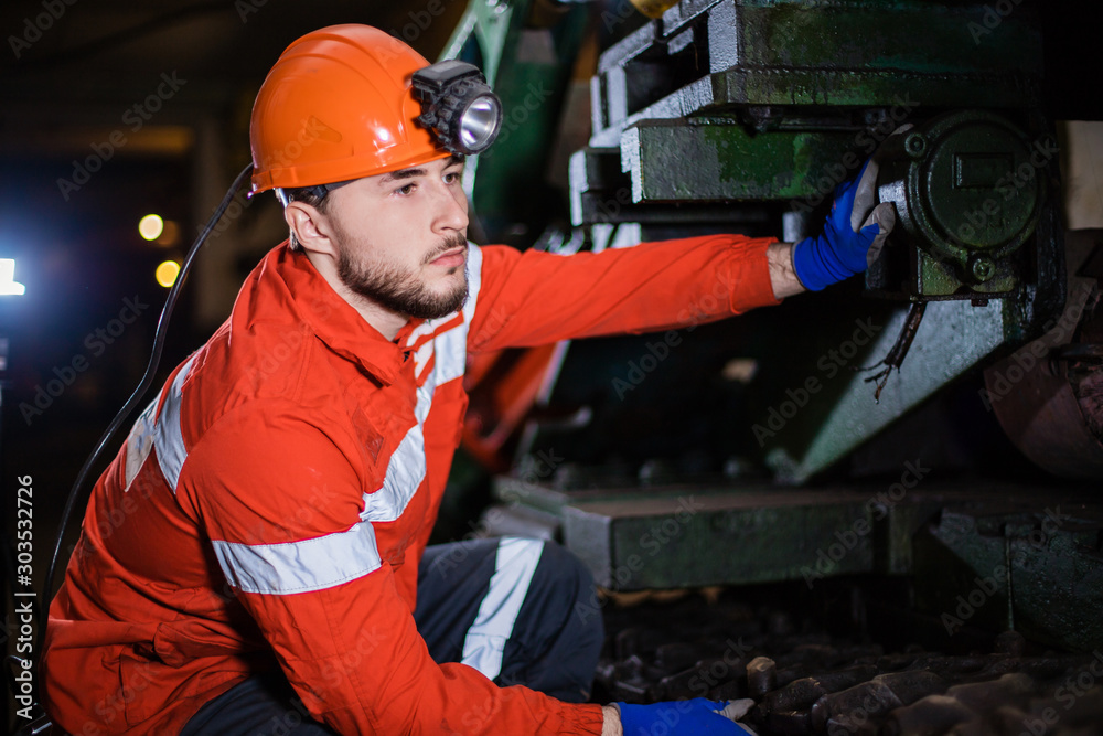 profession of a miner. A young miner in a coal mine in the generals is ...