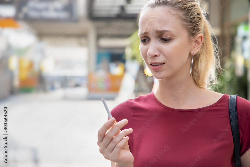 Fotografia do Stock: determined woman trying to quit smoking and ...