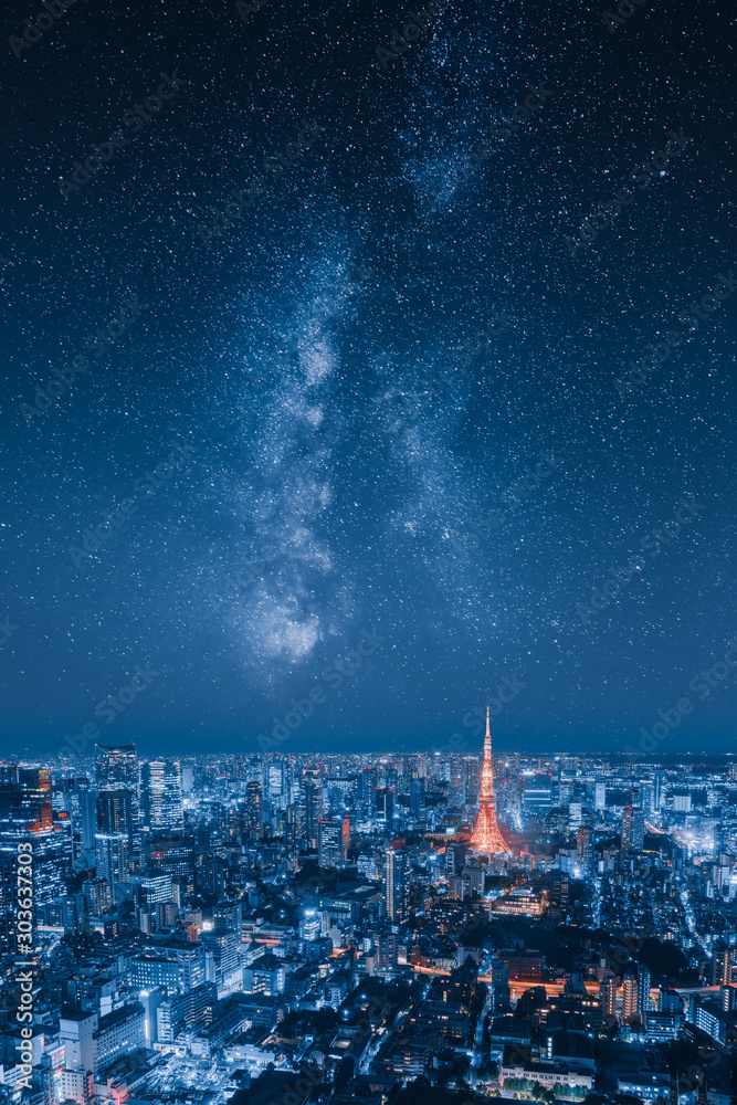 Epic cityscape image of city skyline at night with stars of milky way ...