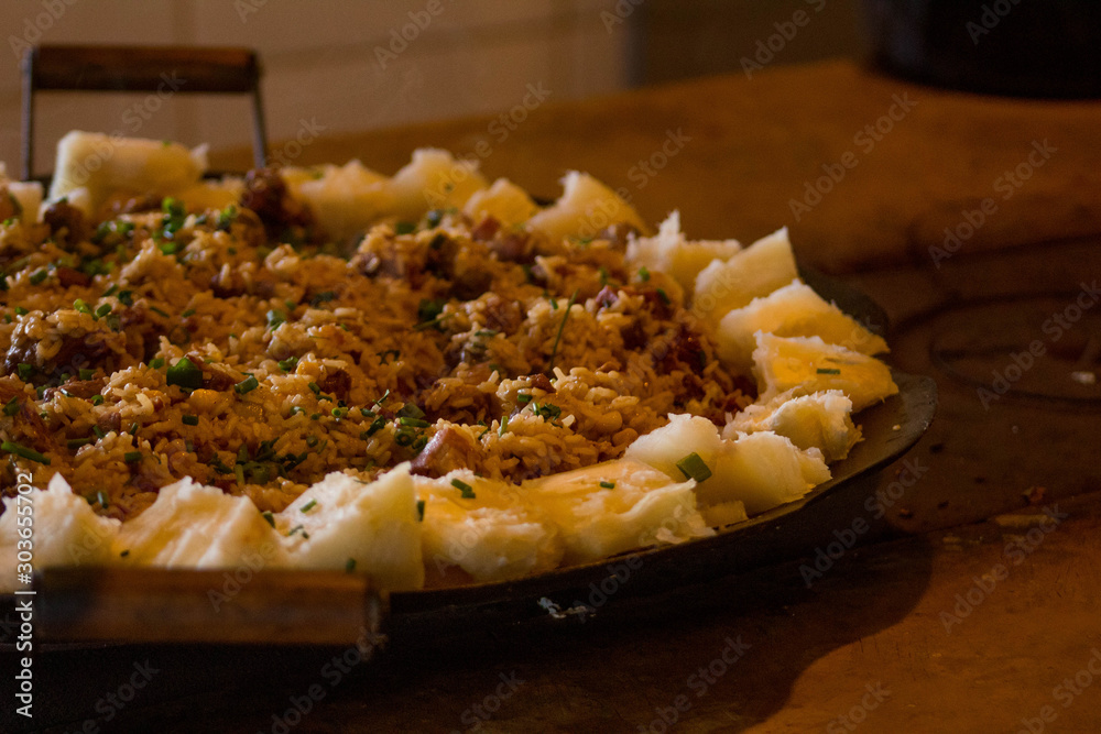 Paella caipira emitting smoke, traditional dish from brazilian ...