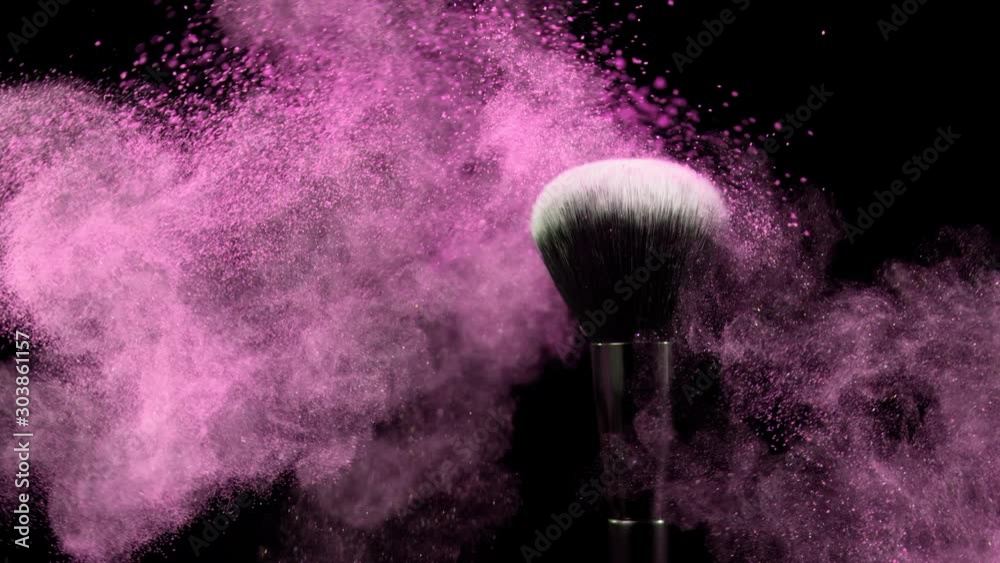 Super Slow Motion Shot of Pink Makeup Powder Falling from Facial Brush ...