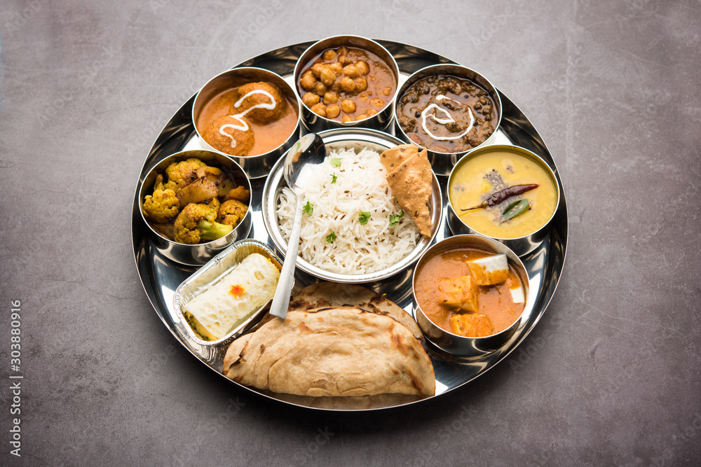 Indian vegetarian Food Thali or platter includes paneer butter masala ...