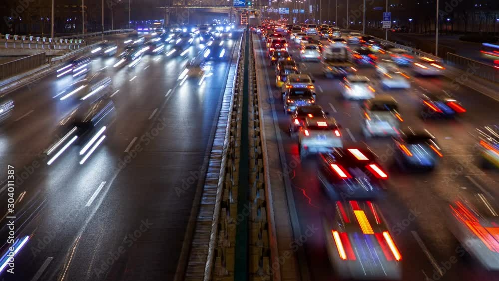 Timelapse heavy traffic of cars with bright headlights driving in ...