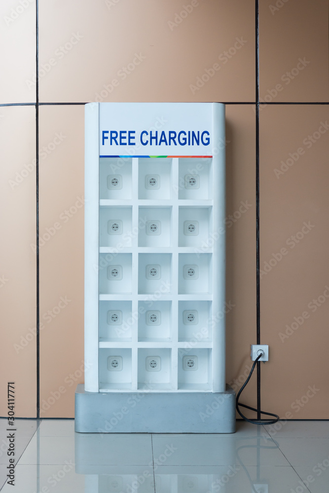 Charging station for mobile devices in modern waiting air plane in the ...