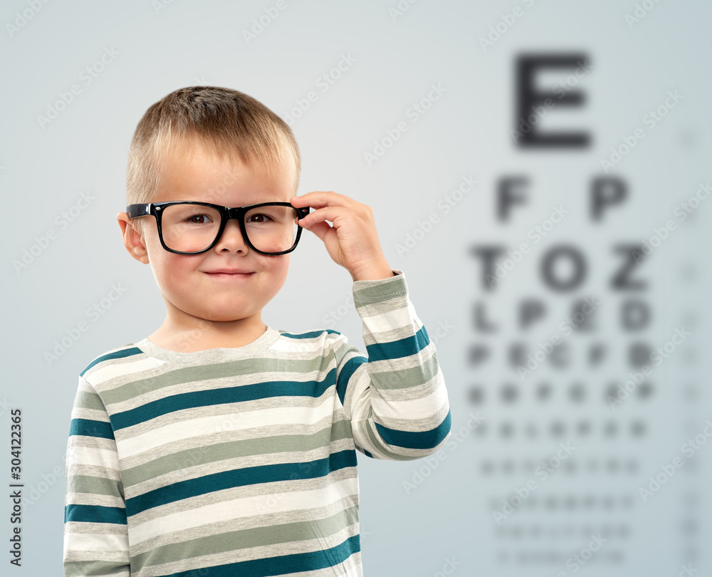 school, education and vision concept - portrait of smiling little boy ...