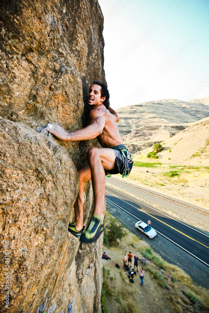 Adrian Daigle climbs Hand Over Hand 5.11a at Granite Point, a small climbing area along the ...