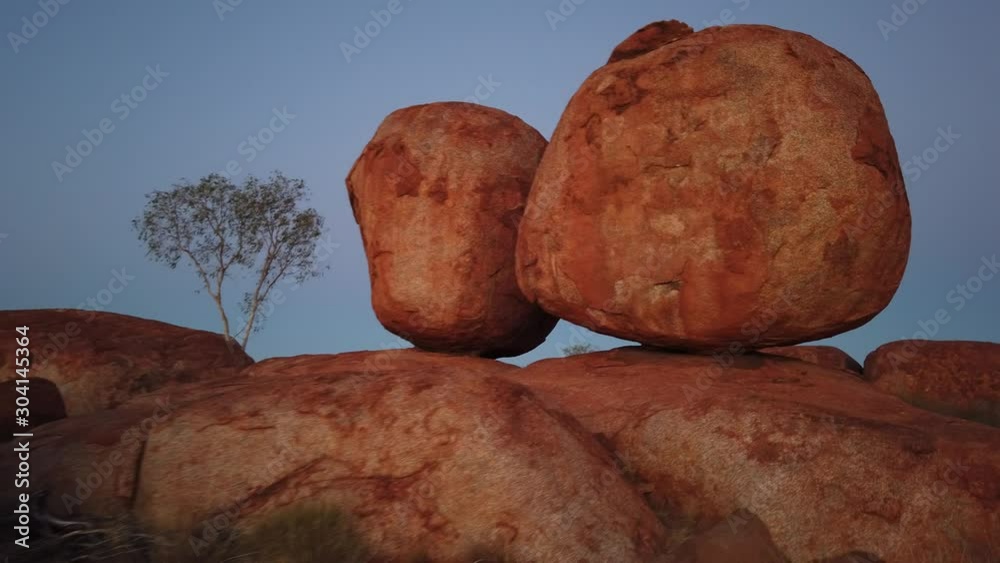 Iconic Devils Marbles: Eggs of mythical Rainbow Serpent with full moon ...