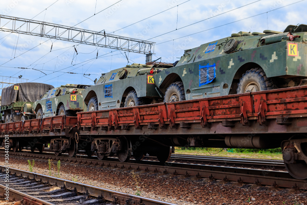 Cargo train carrying military vehicles on railway flat wagons Stock ...