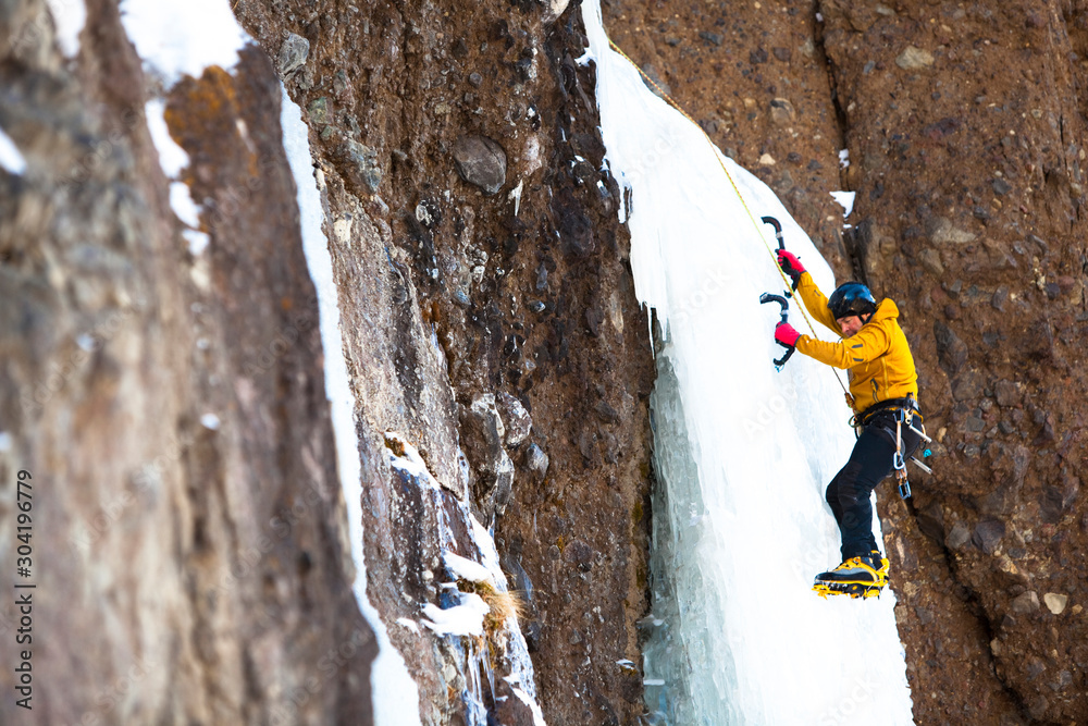 Side view of man alpine climbing Stock Photo | Adobe Stock