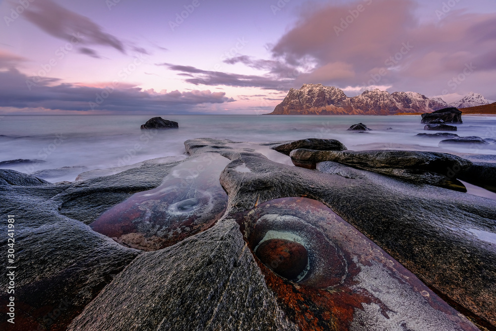 The Dragons Eye is a unique natural rock formation at Uttakleiv Beach ...