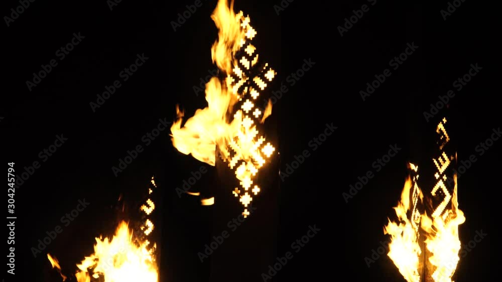 Fire worship. Burning stakes design sample. Close-up of ornamental ...