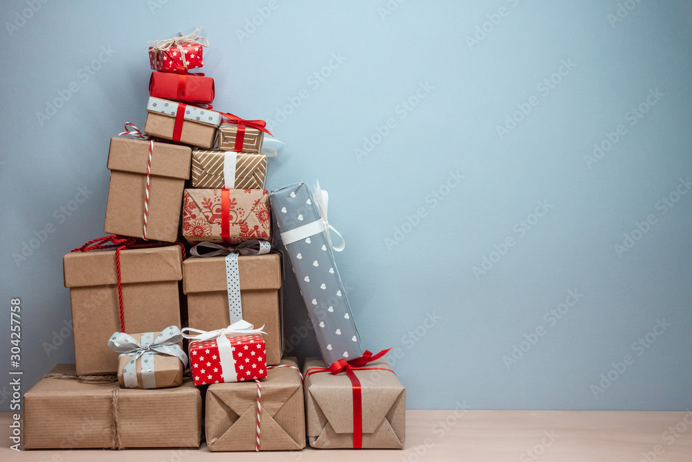 pile of wrapped christmas gifts on blue background Stock Photo | Adobe ... pile of wrapped christmas gifts on blue background Stock Photo | Adobe ...