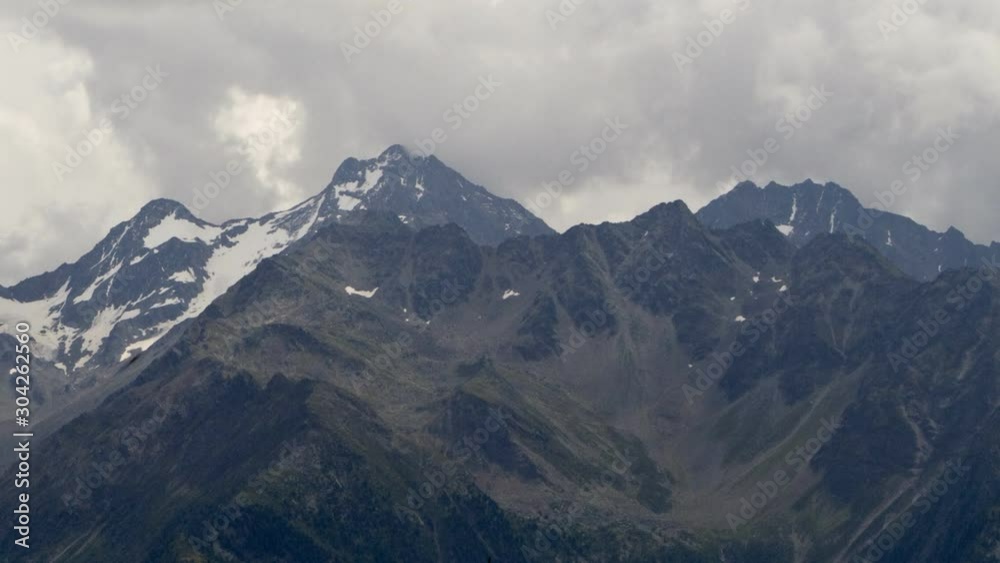 Alpine weather time lapse: Clouds forming and piling up behind a ...