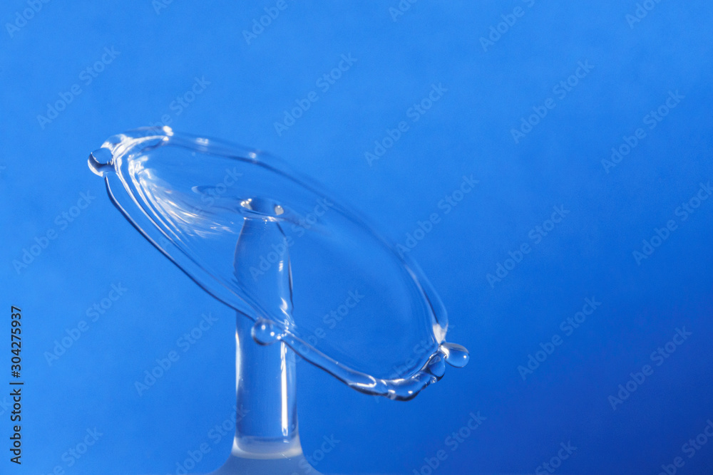 Water drop collision form with blue background Stock Photo | Adobe Stock