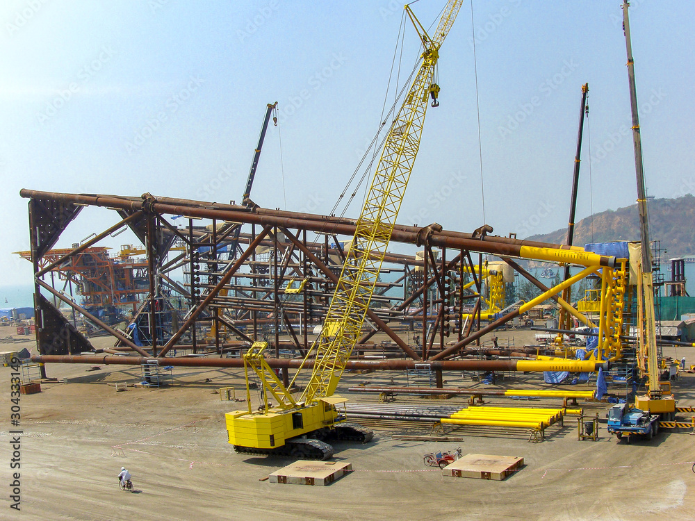 Oil rig platform during construction site in the harbor yard and ...