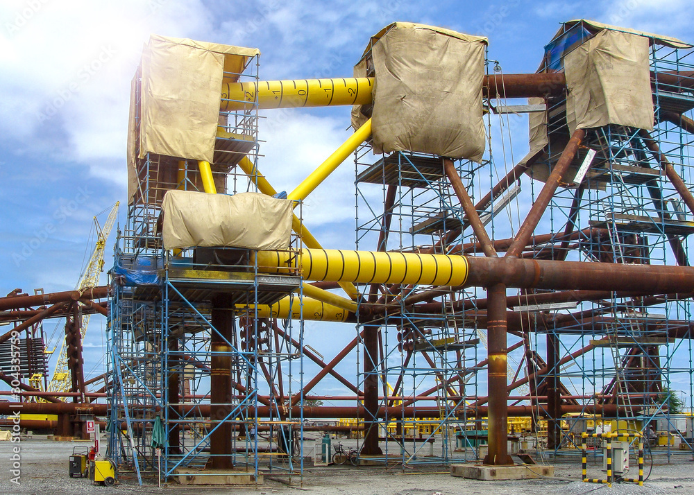Oil rig platform during construction site in the harbor yard and ...