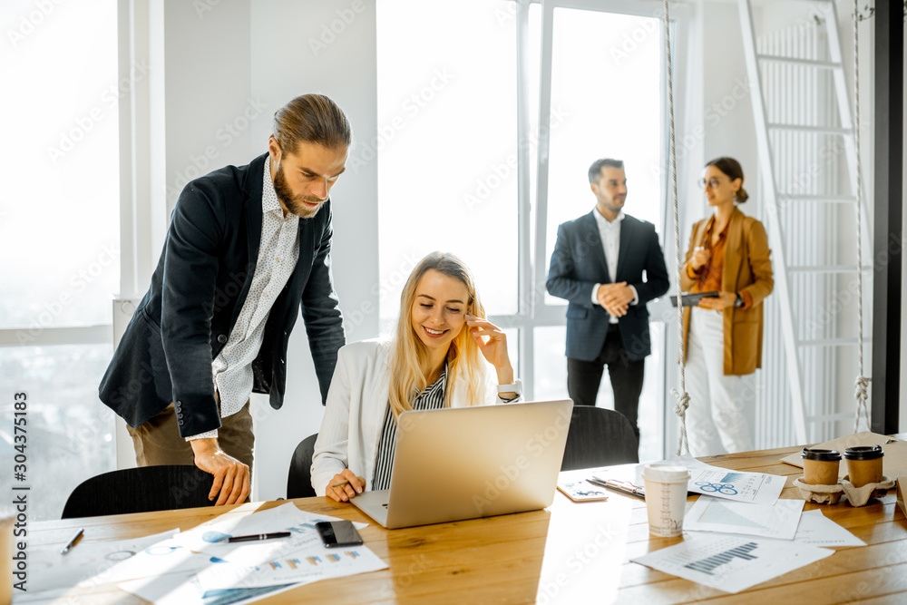 Group of a young office employees dressed casually in the suits having ...