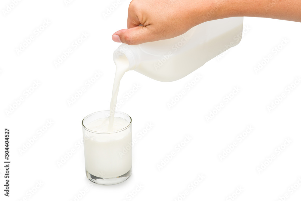 Hand holding Pasteurized fresh milk in a 1 liter plastic gallon while ...