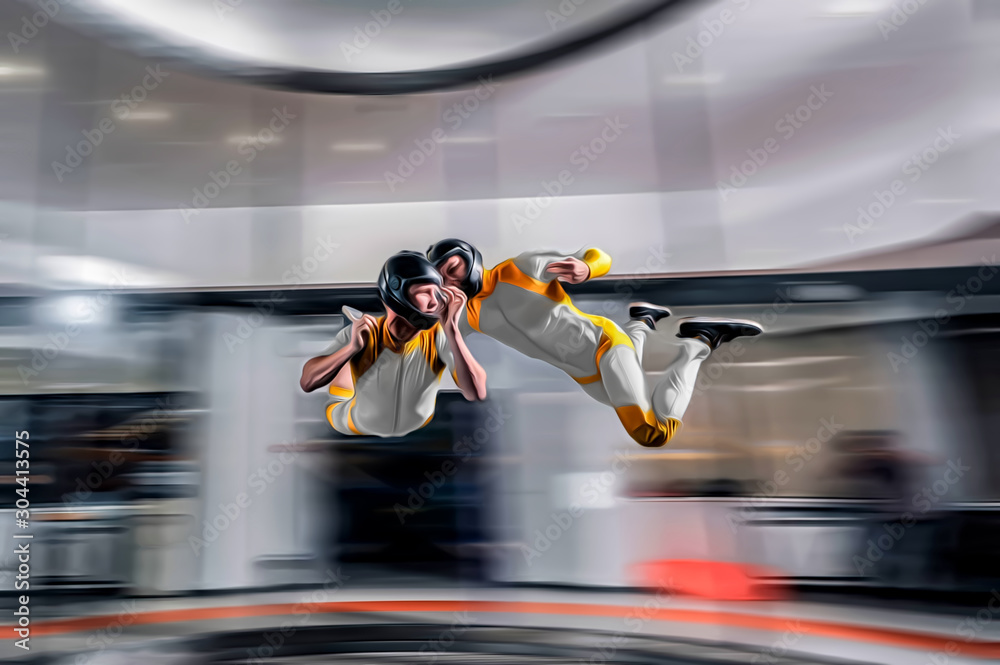 Extreme sports. Levitation in wind tunnel. Indoor sky diving. Team ...