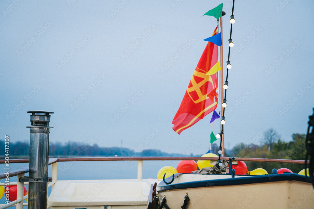 Waving flag with the symbol of Saint Nicholas on the stern of a ...