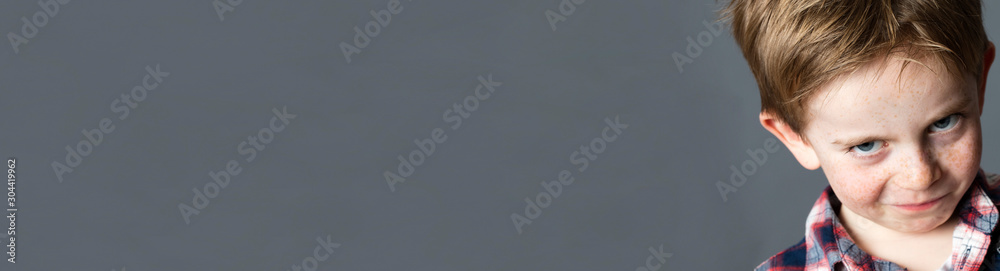 mischievous child with freckles teasing with fun look, panorama Stock ...