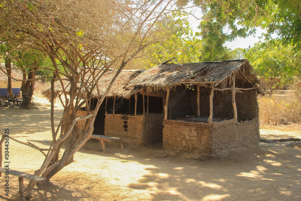 A poor village hut made of wood and clay. The traditional African home ...