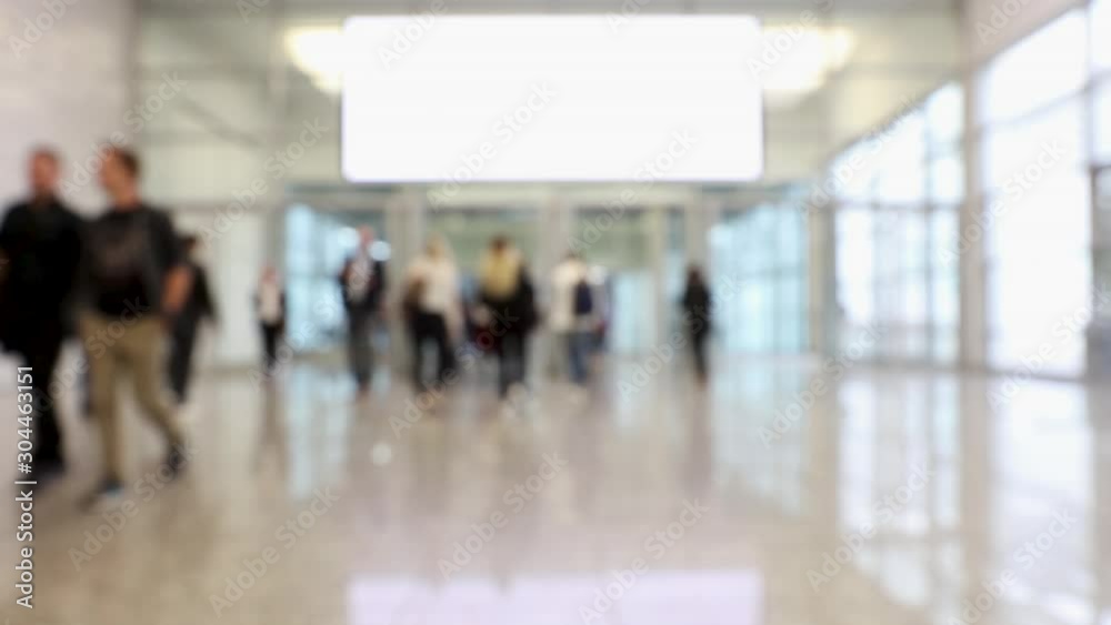 Blurred crowd of people at a convention passing hallway Stock Video ...