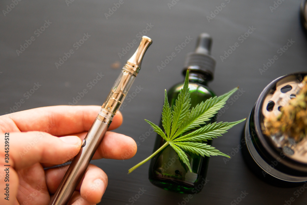 Сannabis extract Vape THC oil. cannabis OIL close up, Cannabis on black background. Product of ...