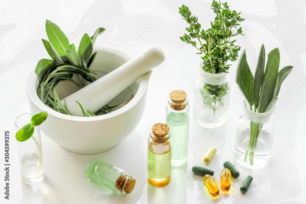 Herbal formulations for health care - herbs and drugs on white ...