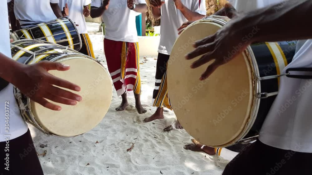 Trio playing traditional music with Boduberu, a Maldivian drum made ...