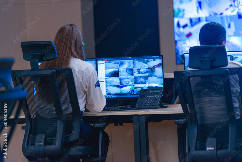 In the System Control Room, Technical Operator Works at His Workstation ...