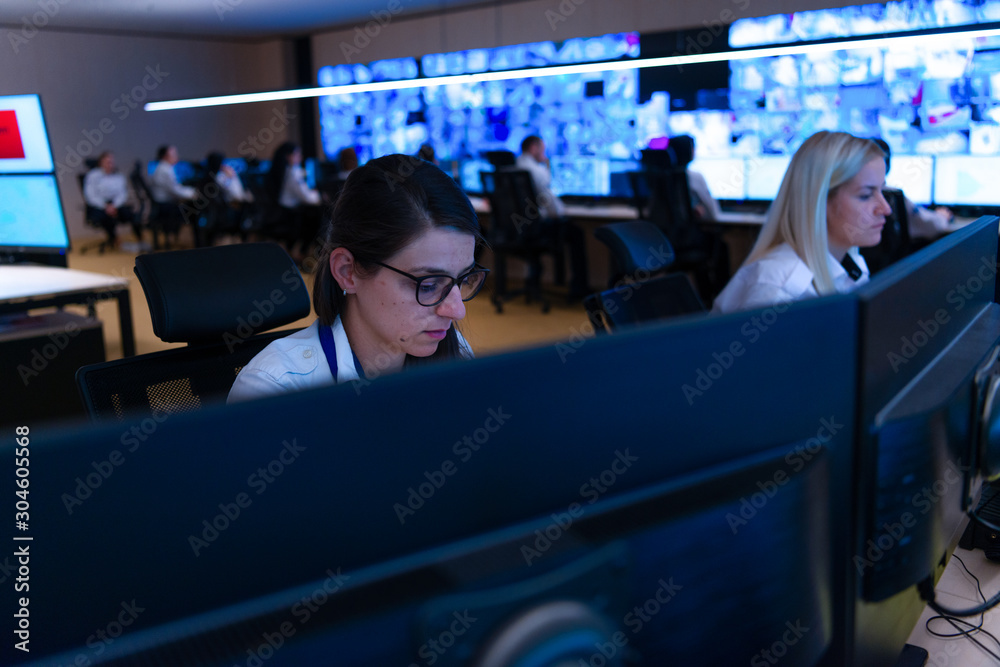 Technical Operator Works at His Workstation with Multiple Displays ...