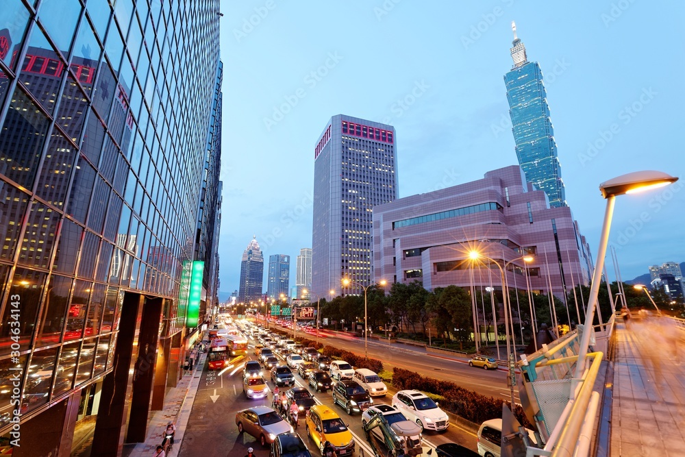 Evening view of a busy street corner in vibrant Downtown Taipei City at ...