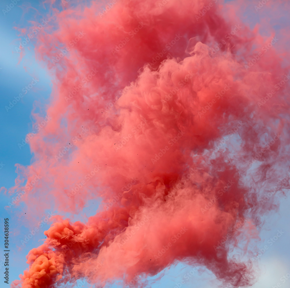 Red smoke on a blue sky Stock Photo | Adobe Stock