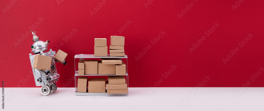 Robot storekeeper sorts goods and parcels on shelves. Silver futuristic ...