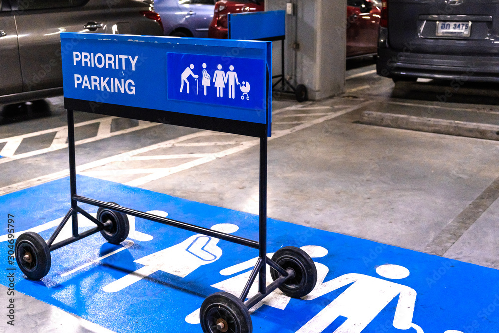 Blue label priority parking sign for car parking in shopping mall ...