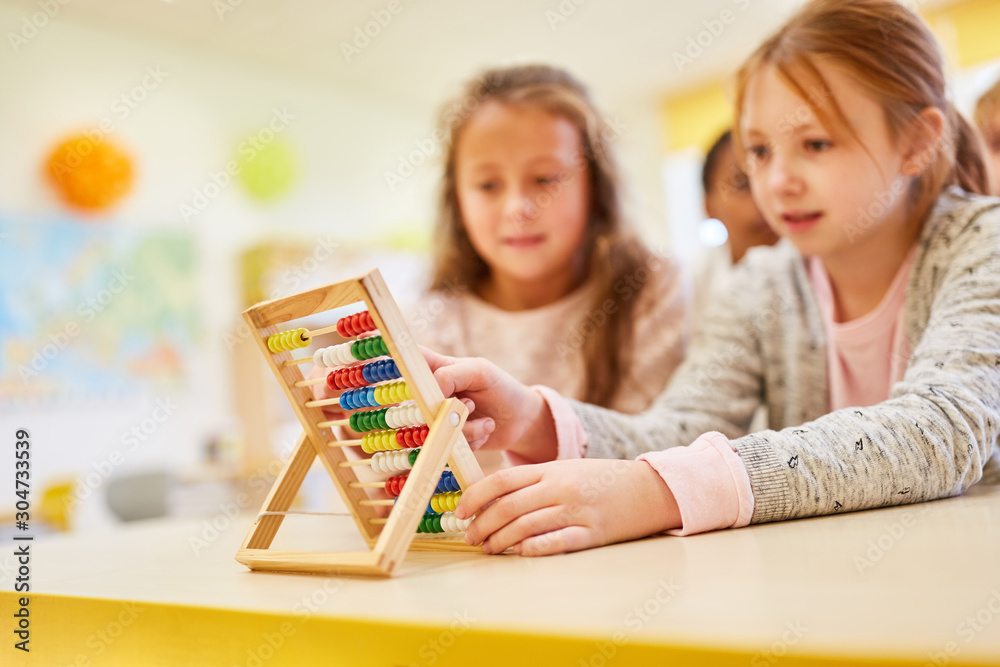 Girls learn to count in elementary school Stock Photo | Adobe Stock